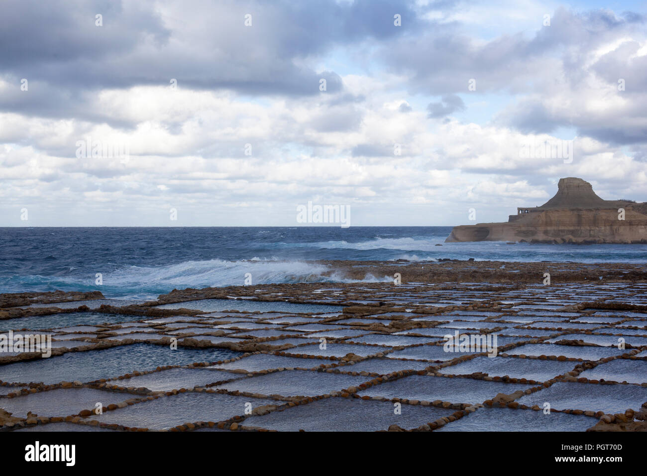 Salt pans and rough sea on Gozo, Malta Stock Photo - Alamy