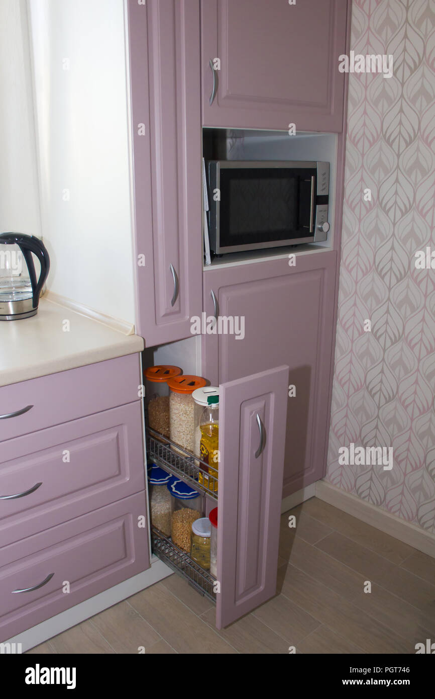 Large light pink kitchen. Interior of a pink kitchen. Wooden Kitchen ...