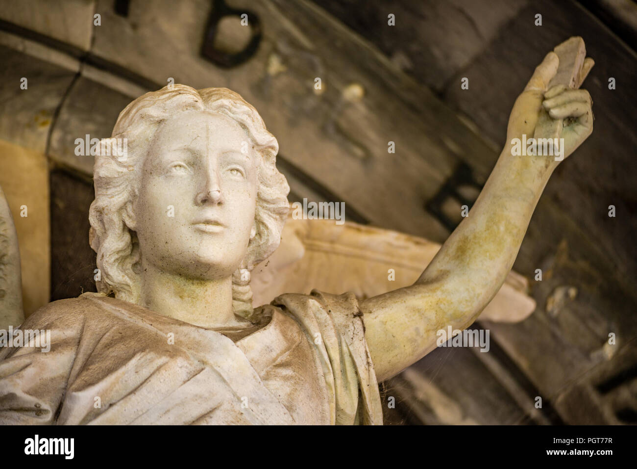 closeup of statue of angel raising hand upwards Stock Photo - Alamy