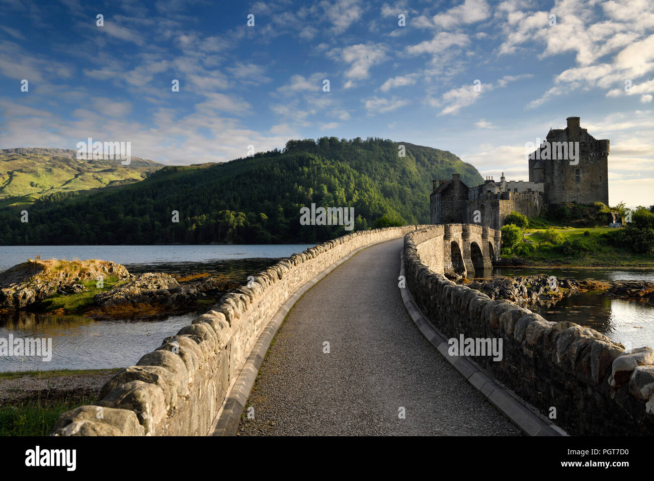 Evening light on new stone arch footbridge to restored Eilean Donan ...