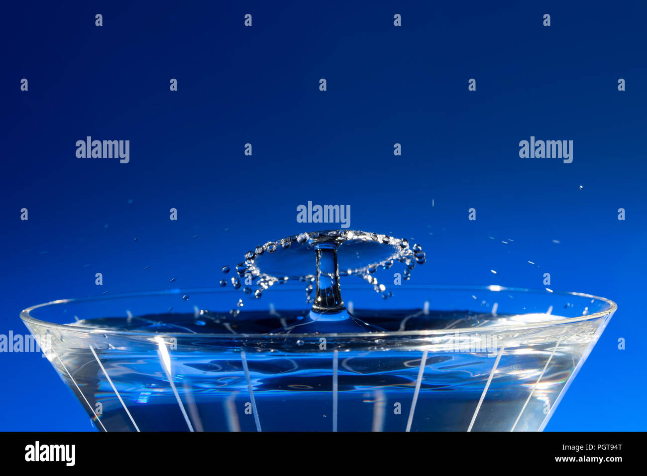 Stop motion picture of a liquid drop colliding with a drop splash over ...