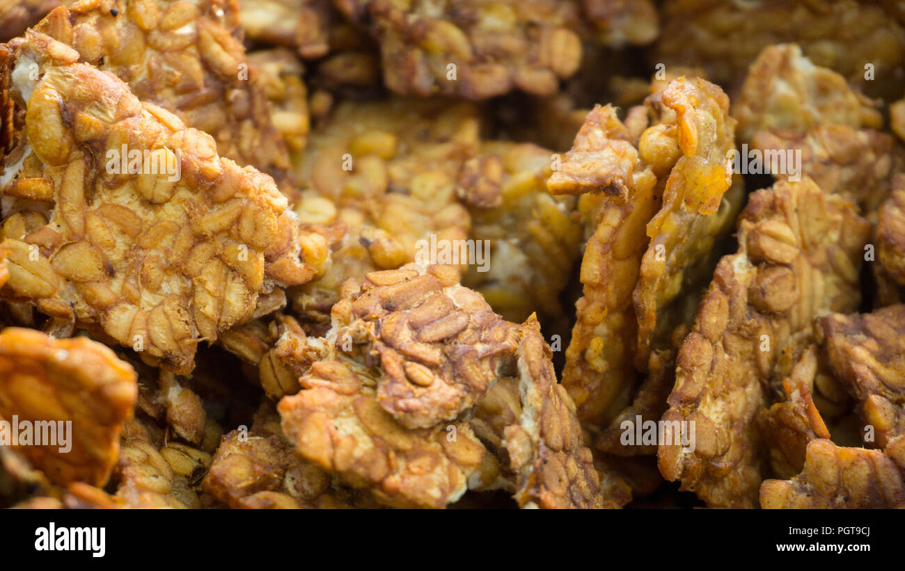 Tempe Goreng. Fried tempeh, or soybean cake, a side dish traditional ...
