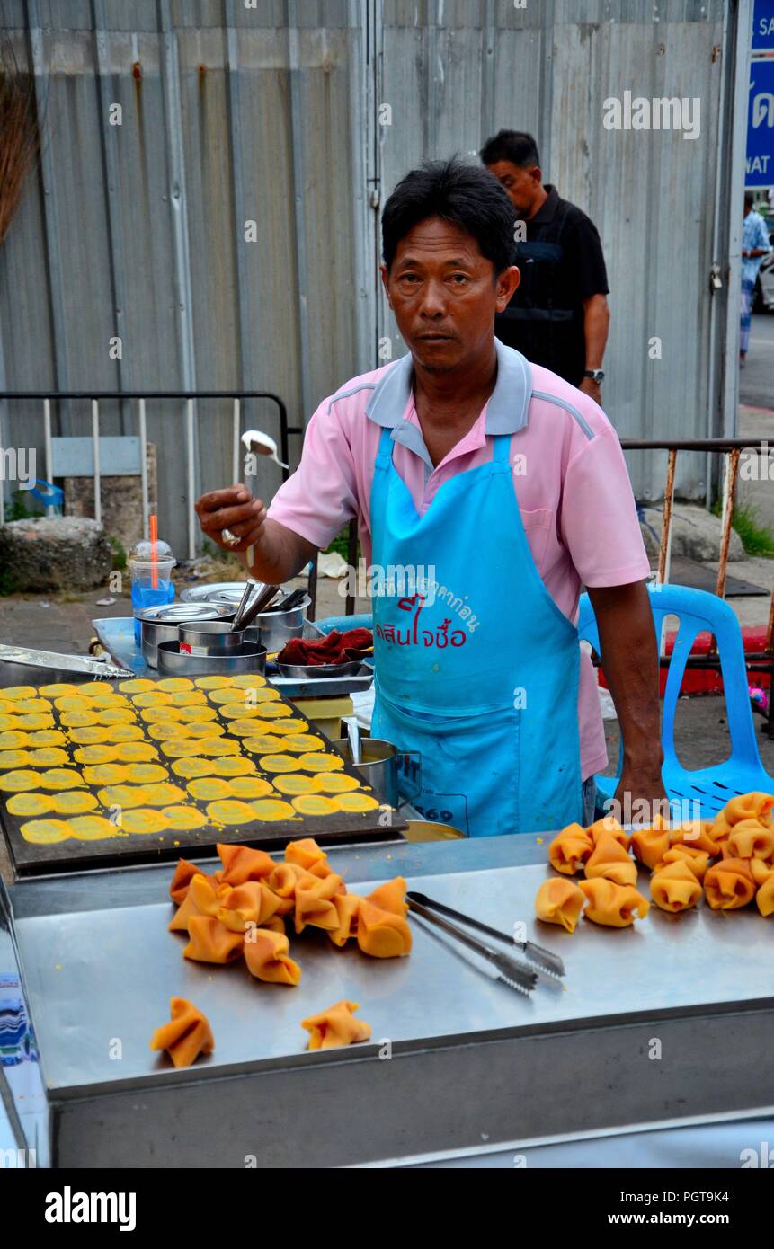 Thai man cooks and prepares street food at market bazaar Pattani ...