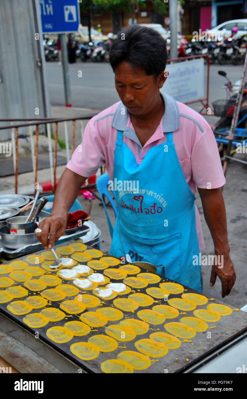 Thai man cooks and prepares street food at market bazaar Pattani ...