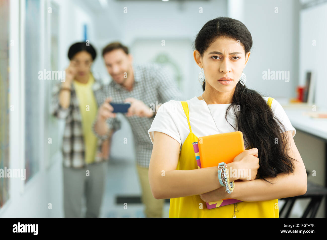 Serious young girl feeling tired of bullying and frowning Stock Photo ...