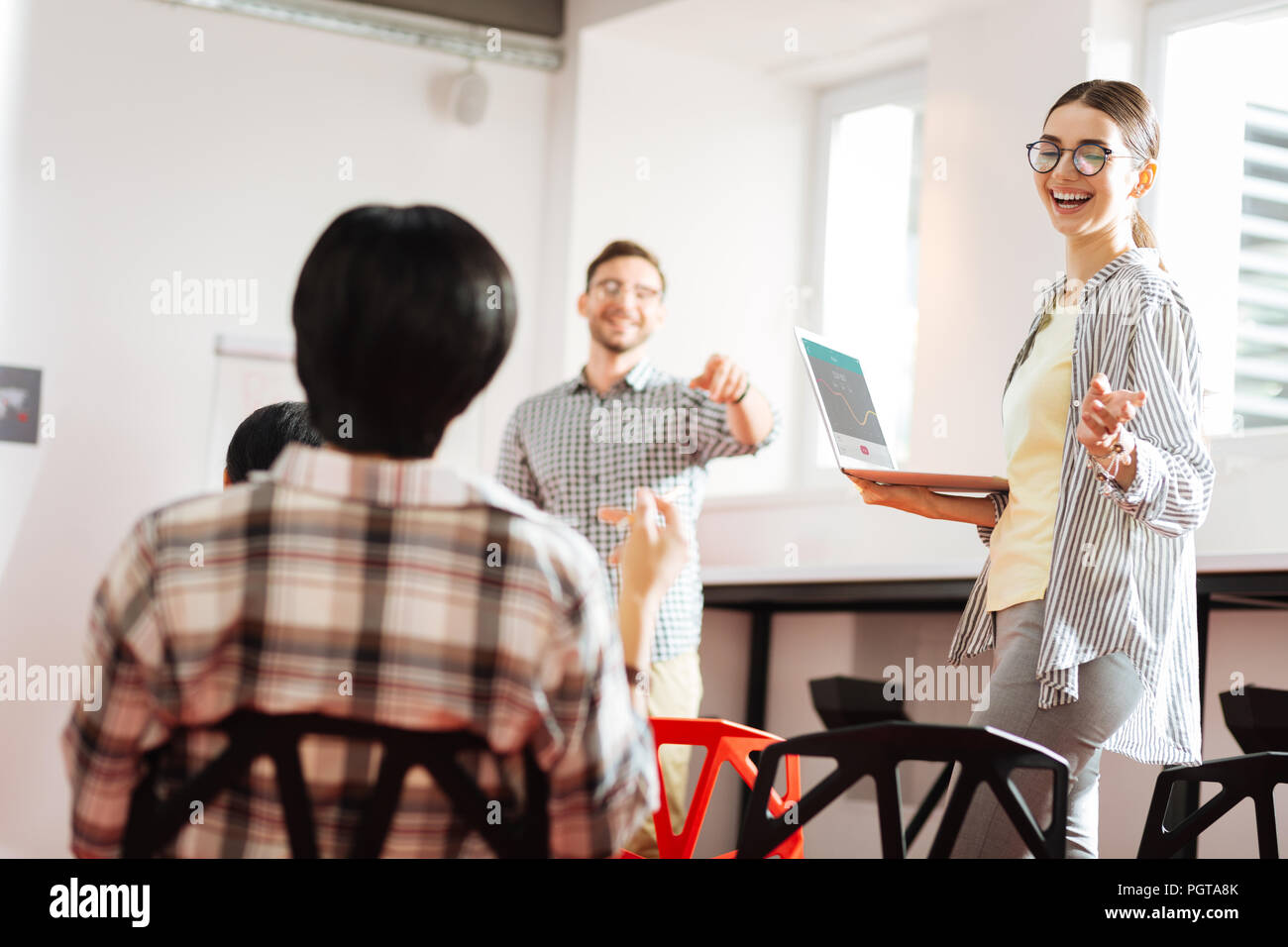 Emotional people laughing at the joke while being at the seminar Stock ...