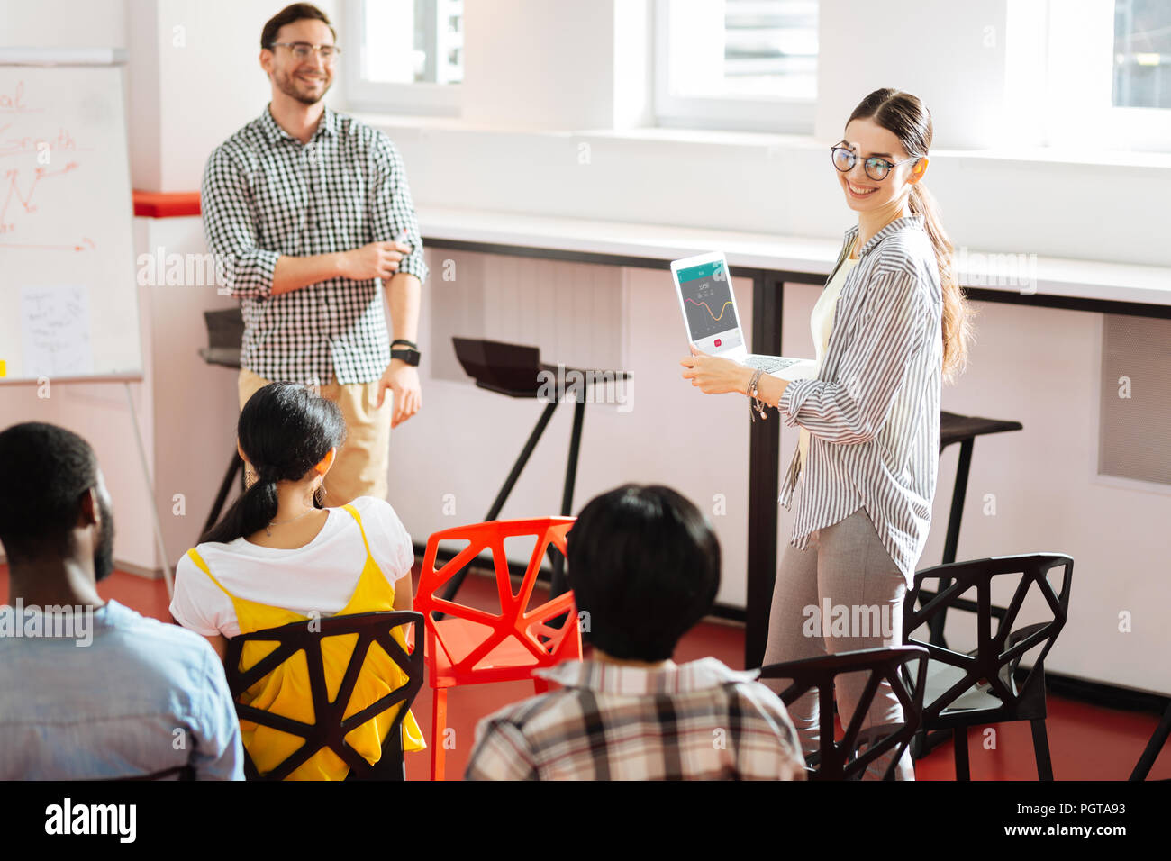 Pretty girl smiling while taking part in interesting discussion Stock ...