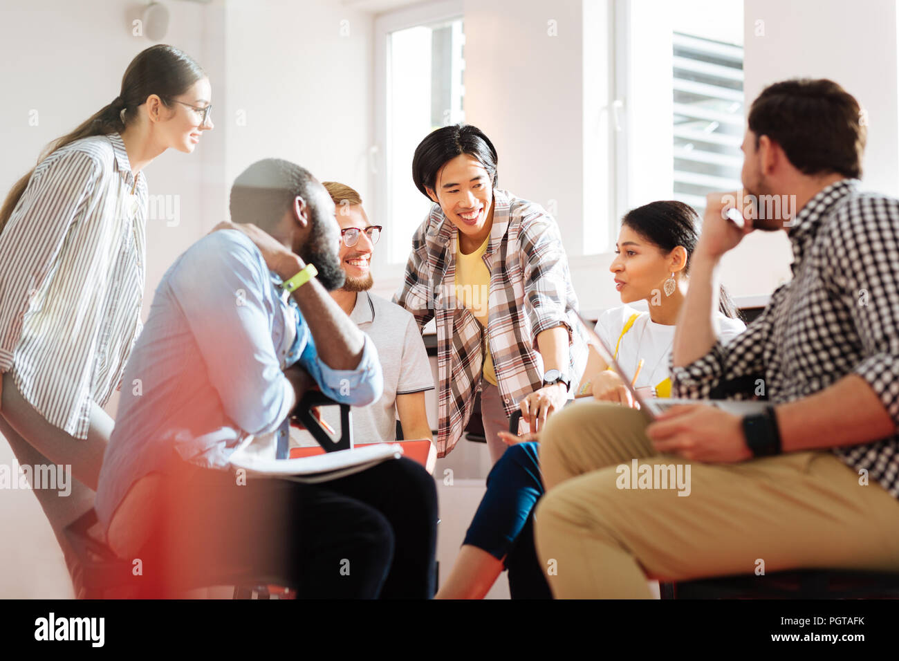 Clever people smiling while getting higher education together Stock ...