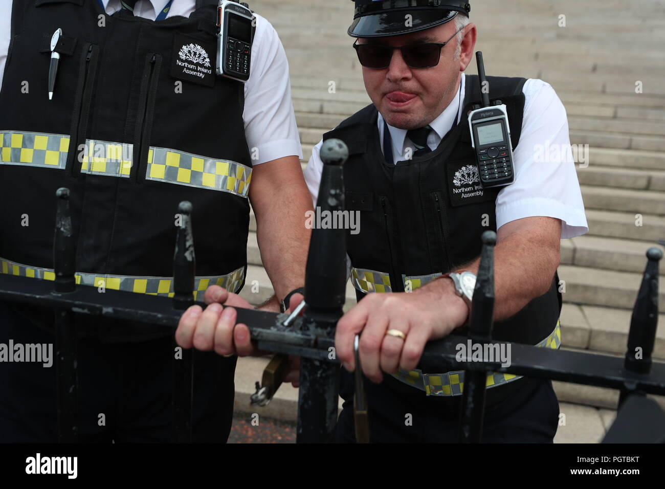 Security guards lock gates outside parliament buildings stormont hi-res ...
