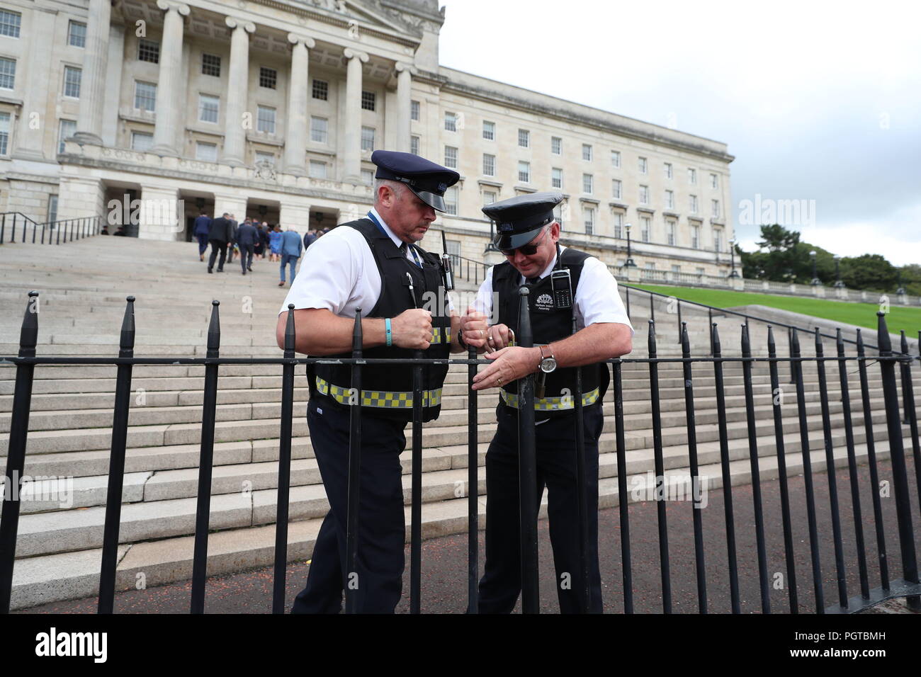 Security guards lock gates outside parliament buildings stormont hi-res ...