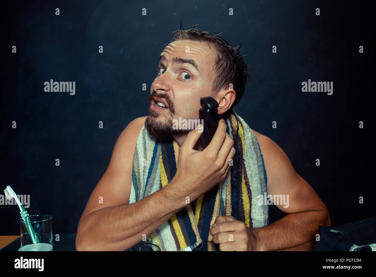 Man shaving face sad hi-res stock photography and images - Alamy