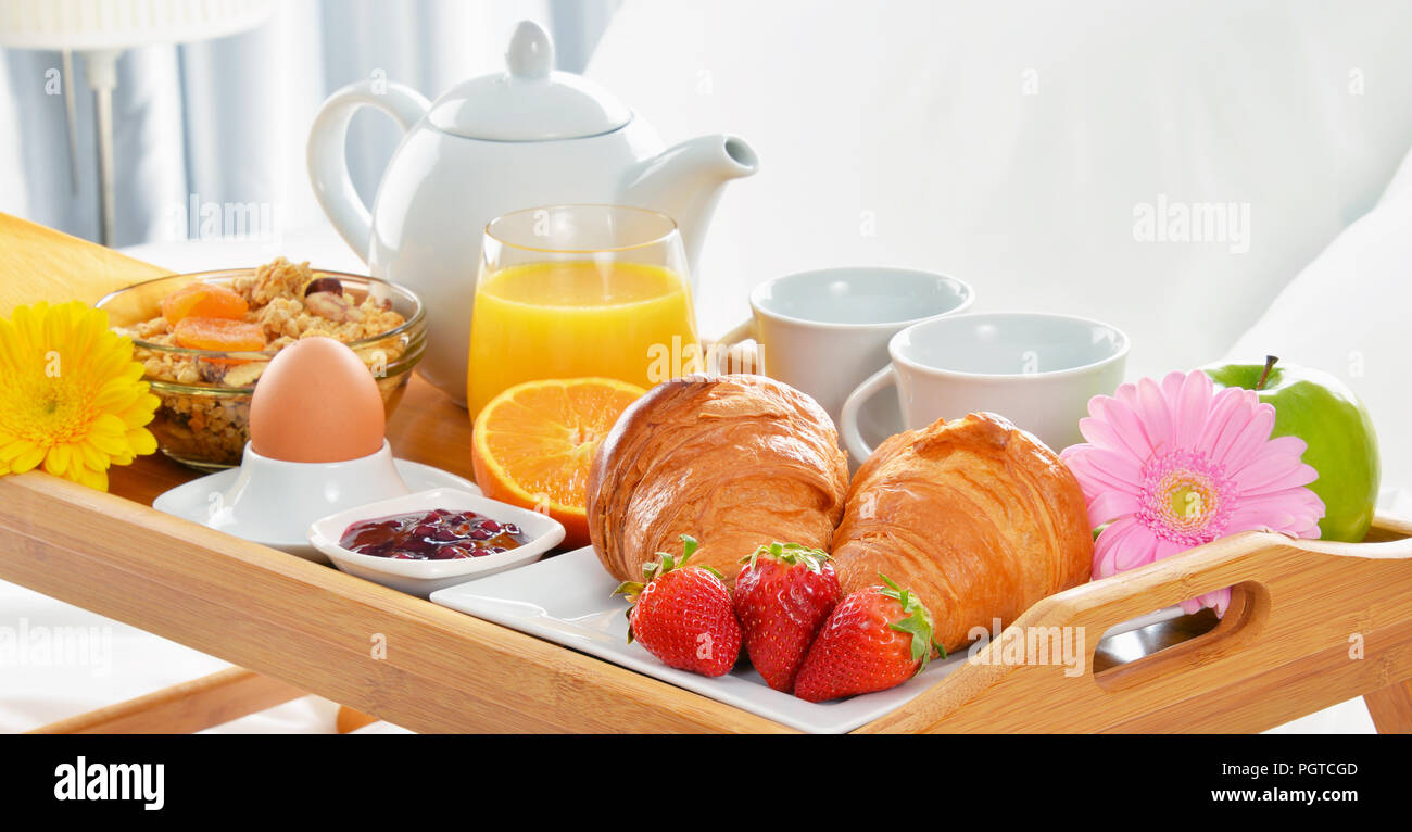 Breakfast tray in bed in hotel room Stock Photo - Alamy