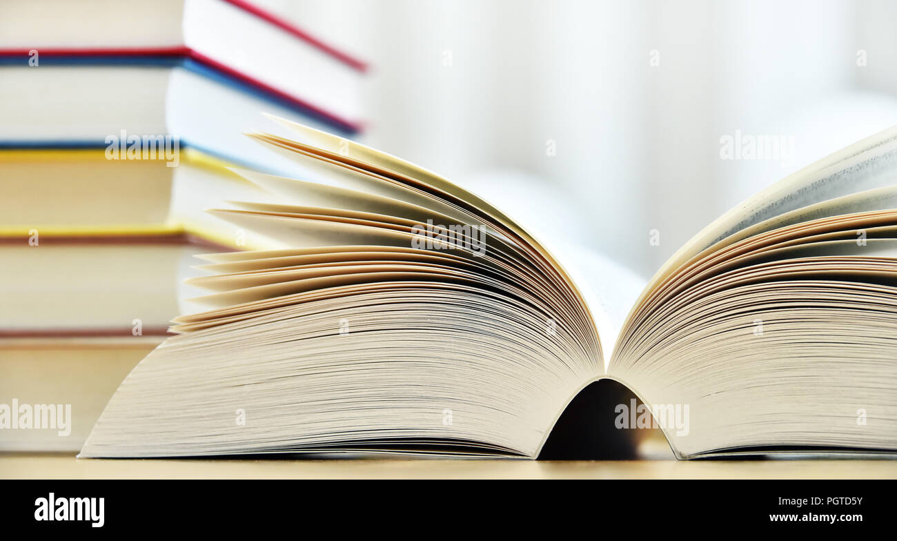 Books lying on the table in the public library Stock Photo - Alamy