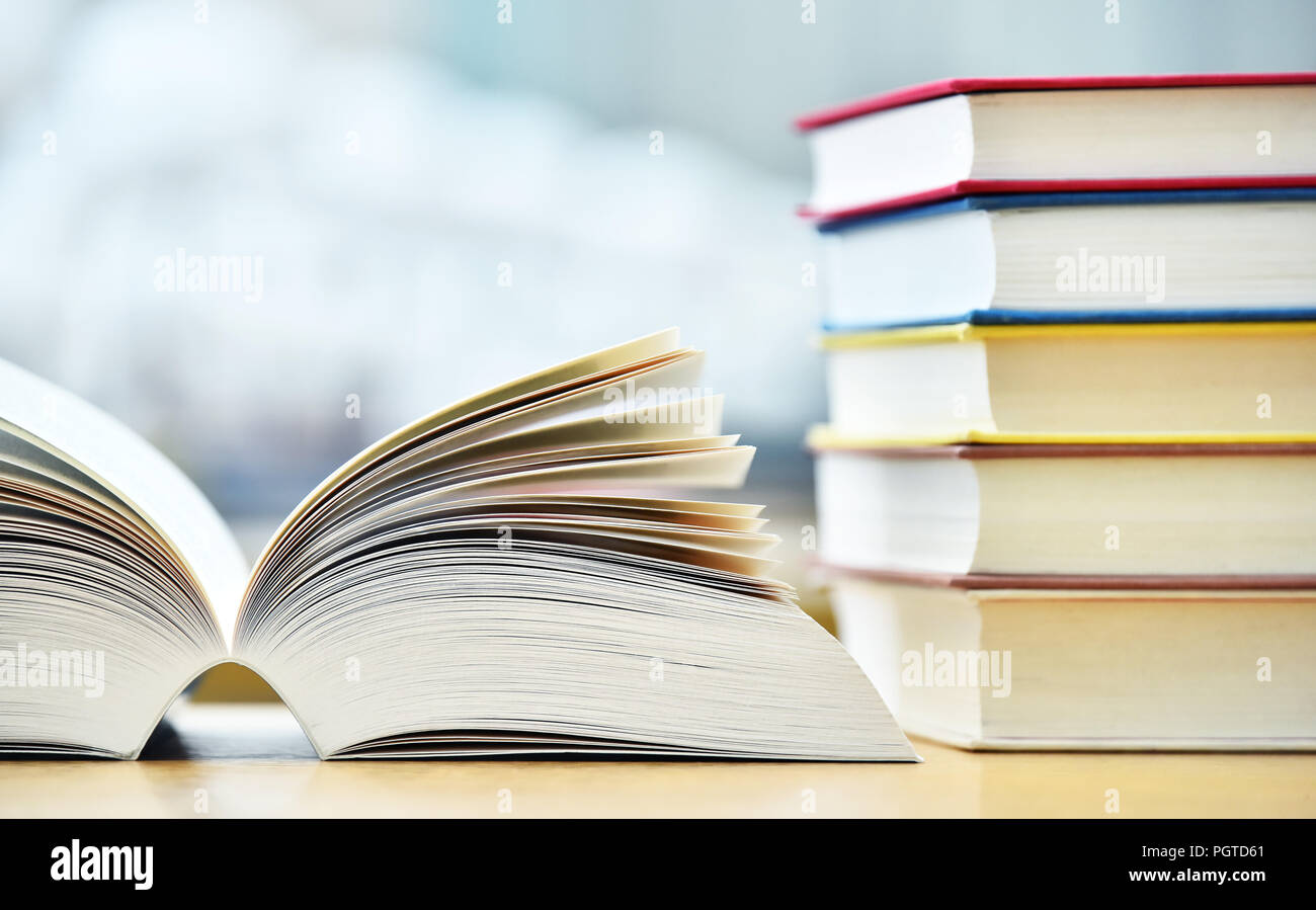 Books lying on the table in the public library Stock Photo - Alamy