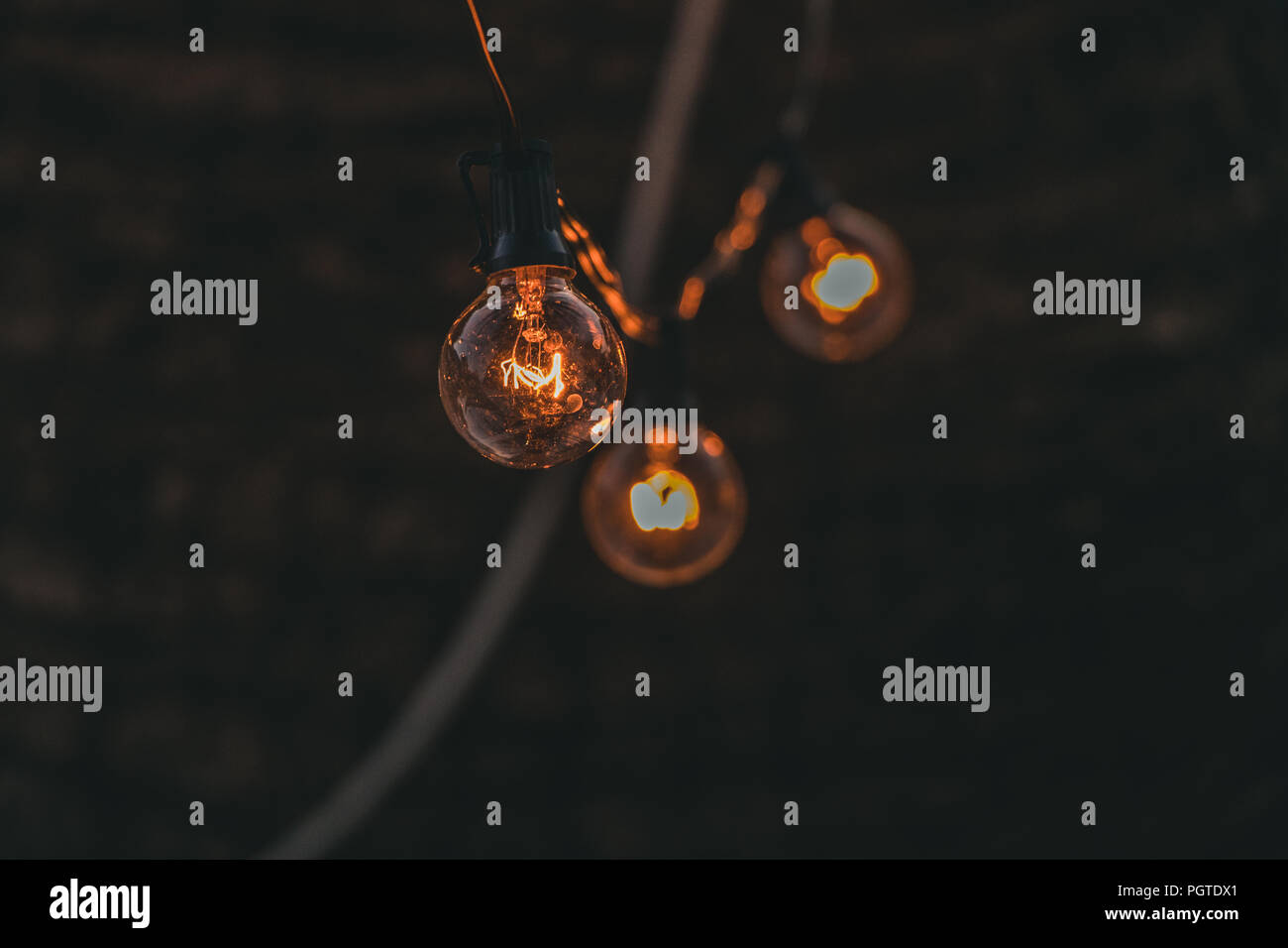 Tring of lights between two trees Stock Photo - Alamy