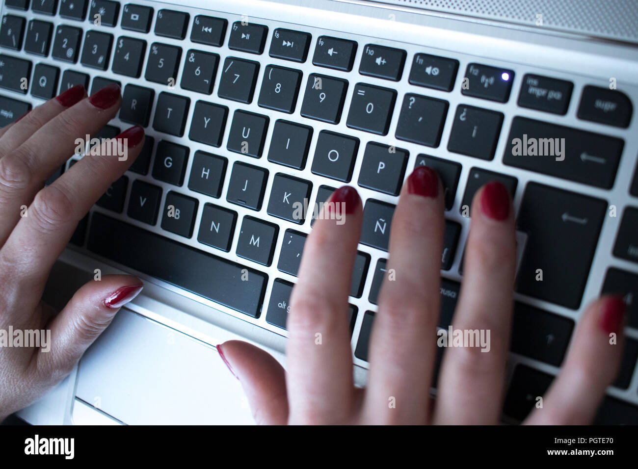 Secretary typist typing on laptop pc computer keyboard keys with hands ...