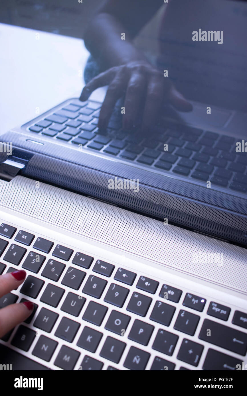 Secretary typist typing on laptop pc computer keyboard keys with hands ...