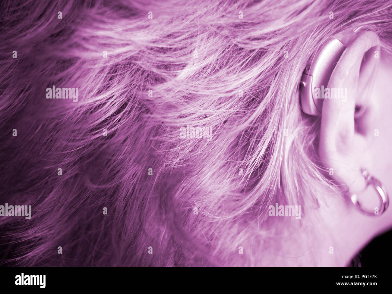 Deaf lady with modern technology digital hearing aid in her ear Stock ...