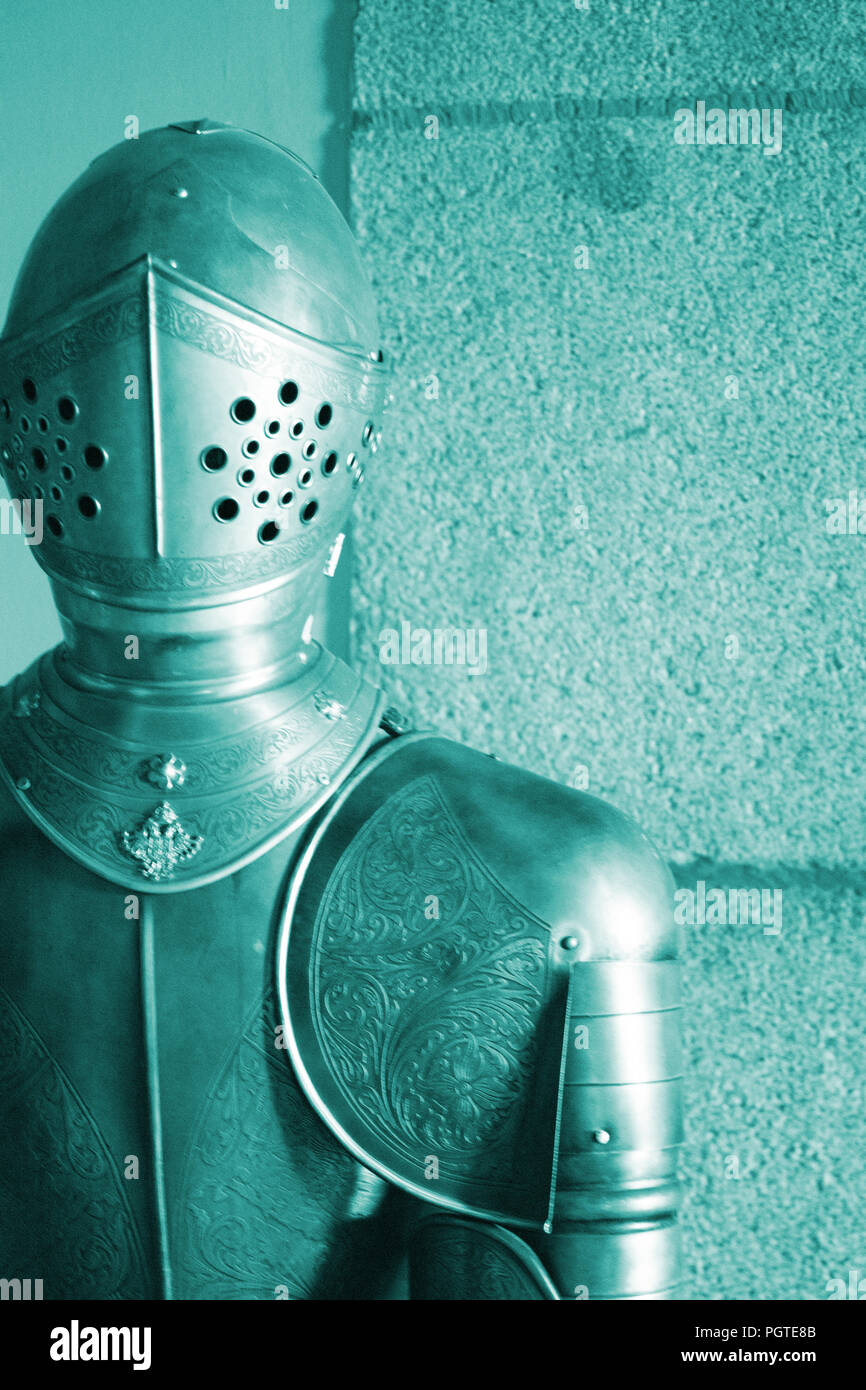 Medieval metal suit of armour and helmet worn by knight in middle ages ...