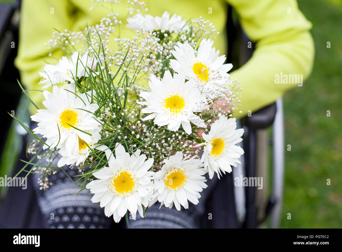 Elderly paralyzed woman receiving a flower bouquet - nursing home ...