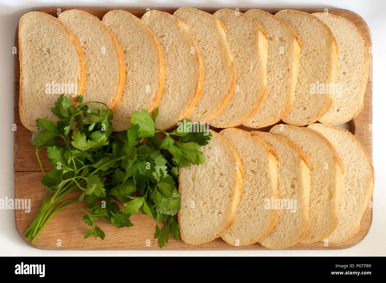 cutting bread on a board Stock Photo - Alamy