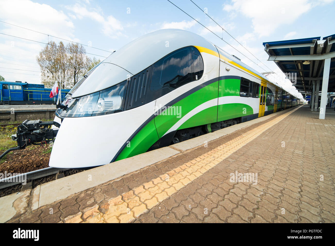 modern train standing at railway station Stock Photo - Alamy