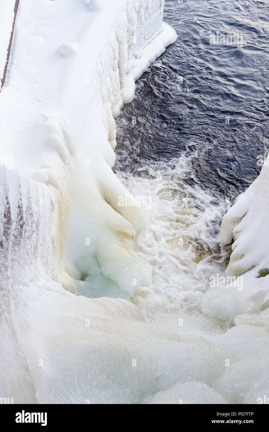 Dam at winter flowing water and ice formations Stock Photo - Alamy