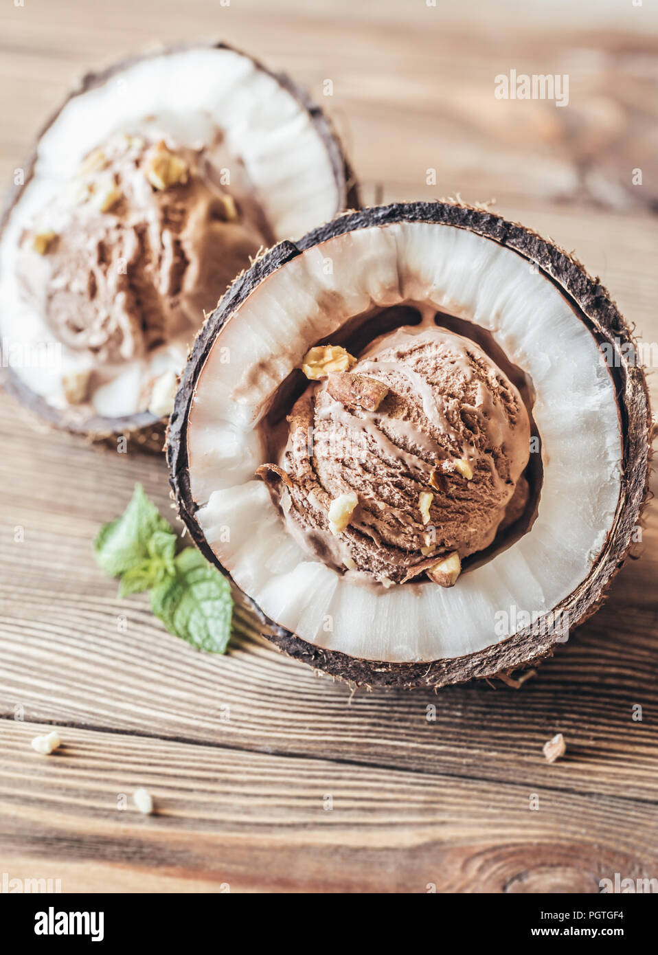 Chocolate ice cream in the coconut halves Stock Photo - Alamy