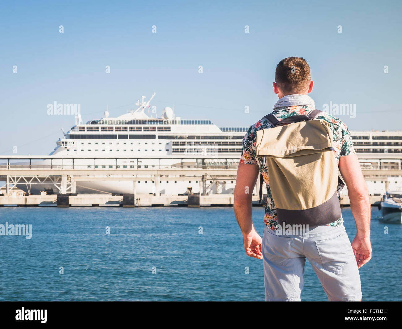 Attractive, stylish guy with a backpack Stock Photo - Alamy