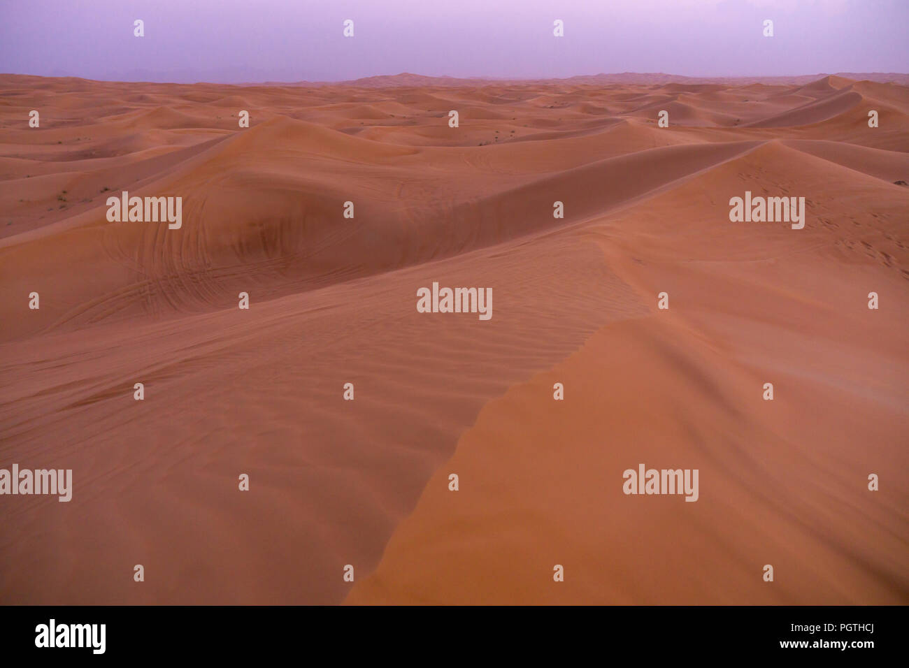 Dubai Desert Al Mada at sunset Stock Photo - Alamy