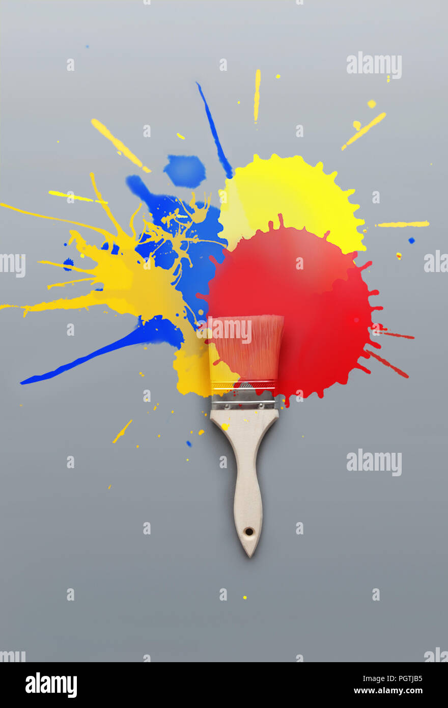 Various colours of paint splattered over a brush Stock Photo - Alamy