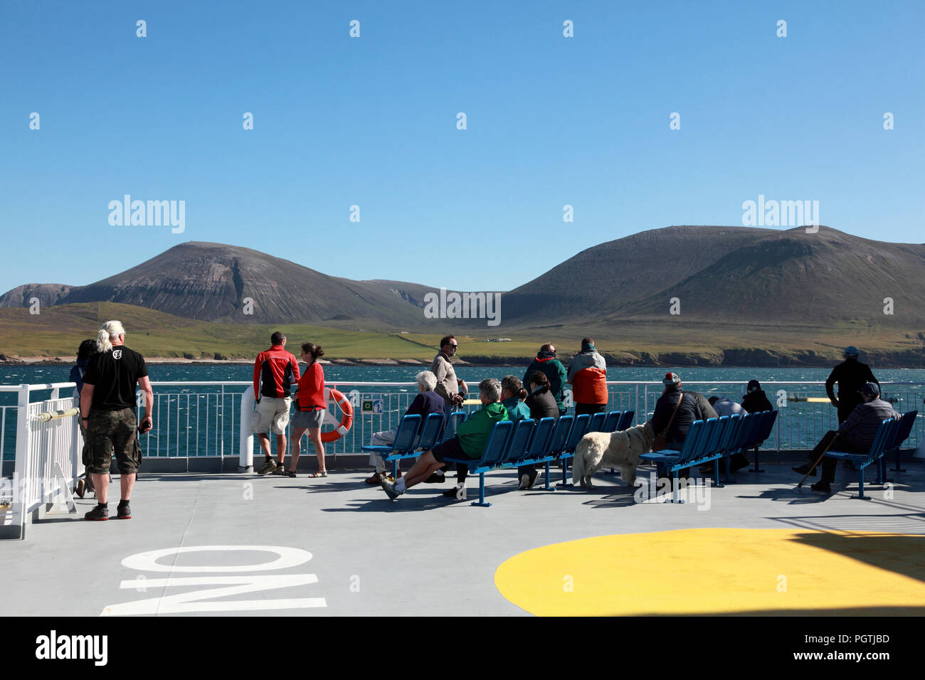 The Northlink ferry MV Hamnavoe passing The Cuilags on the left and ...
