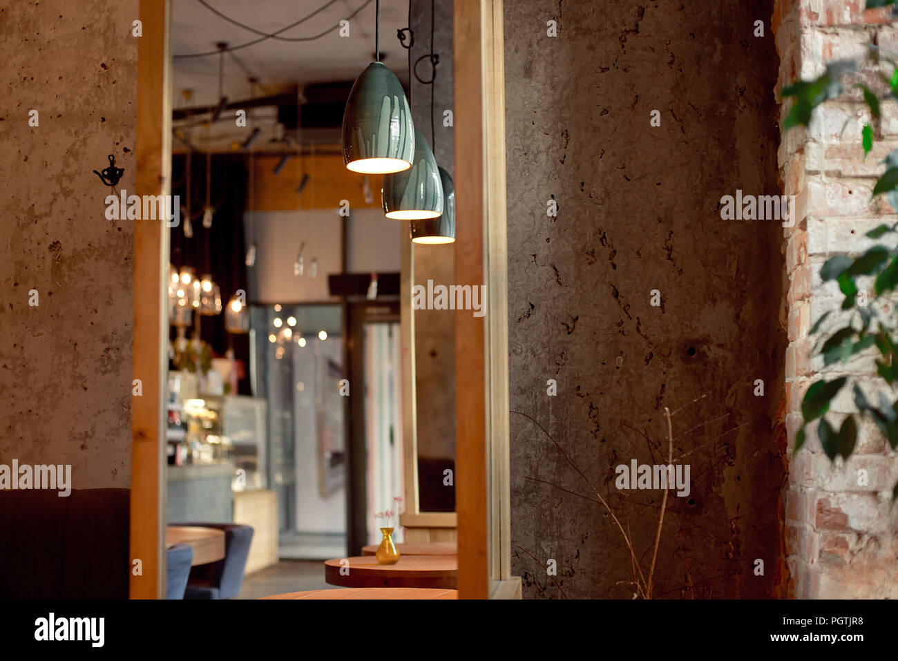 Modern loft style cafe interior in warm colors Stock Photo - Alamy