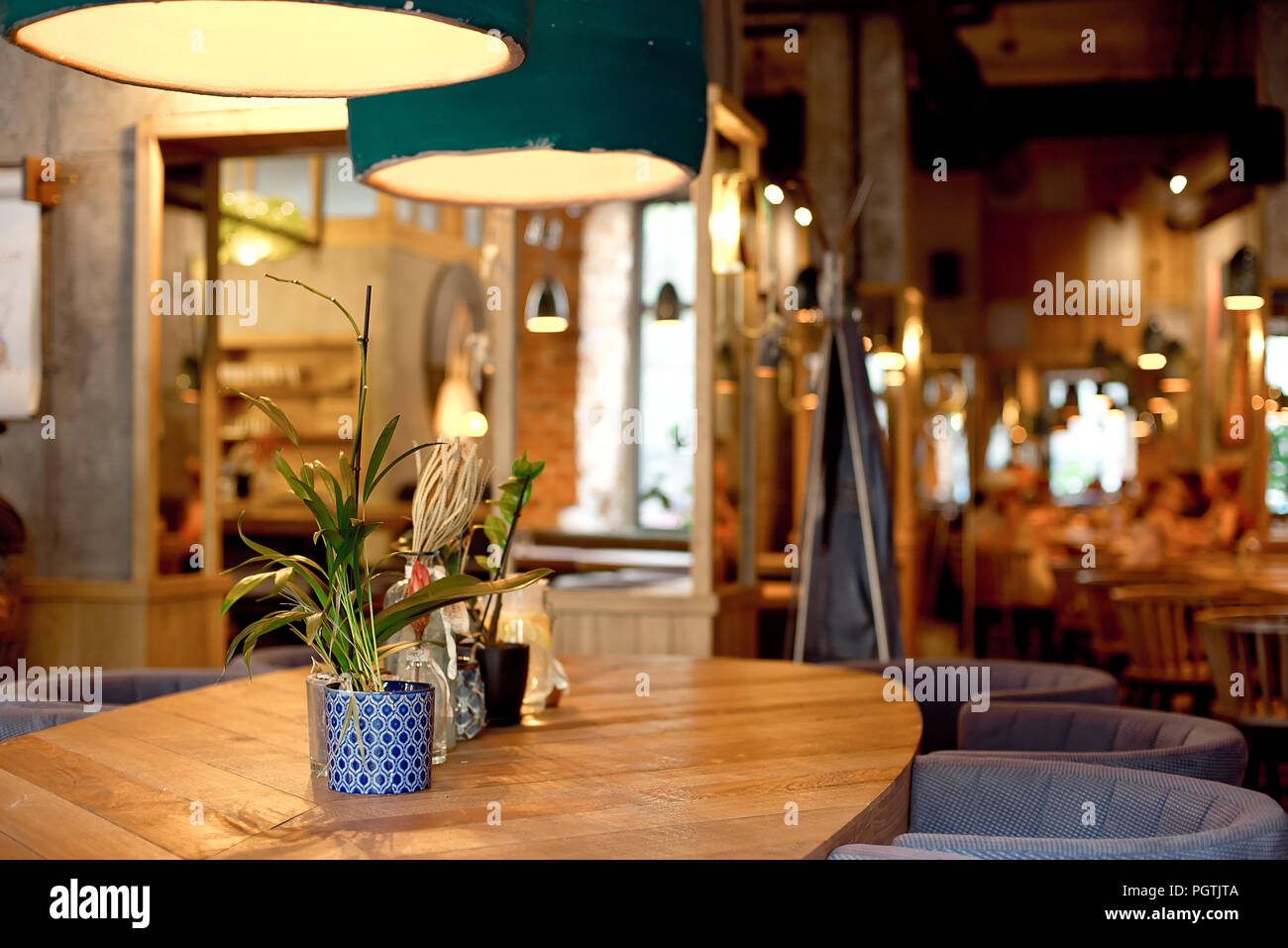 Modern loft style cafe interior in warm colors Stock Photo - Alamy