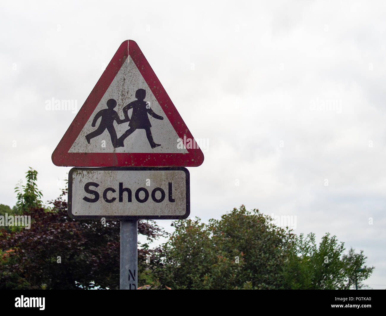 A dirty school warning sign UK Stock Photo - Alamy