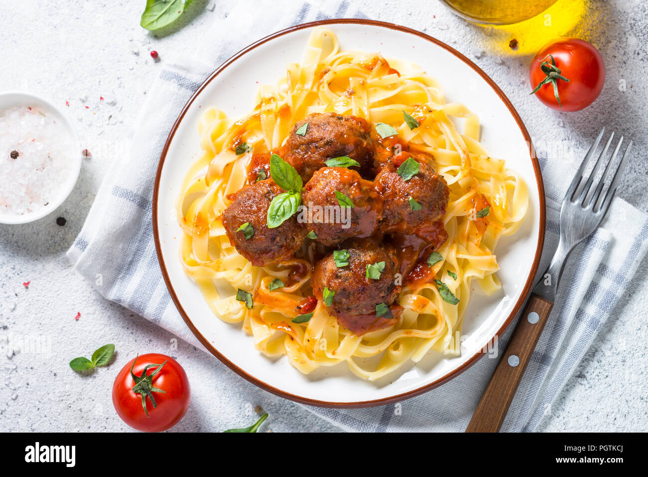 Meatballs in tomato sauce with pasta tagliatelle top view Stock Photo ...