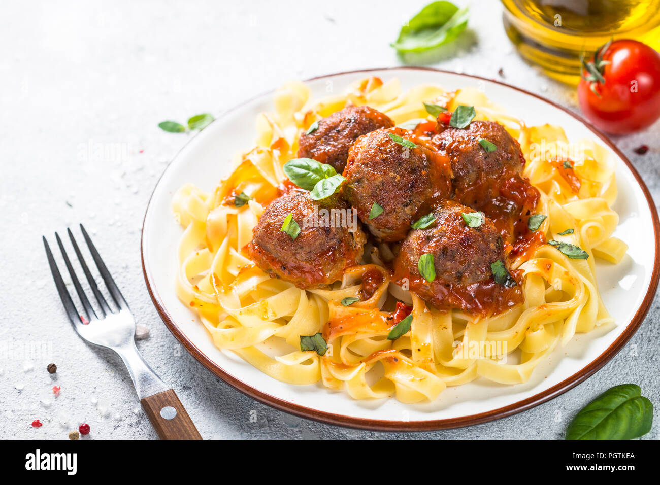 Meatballs in tomato sauce with pasta tagliatelle top view Stock Photo ...