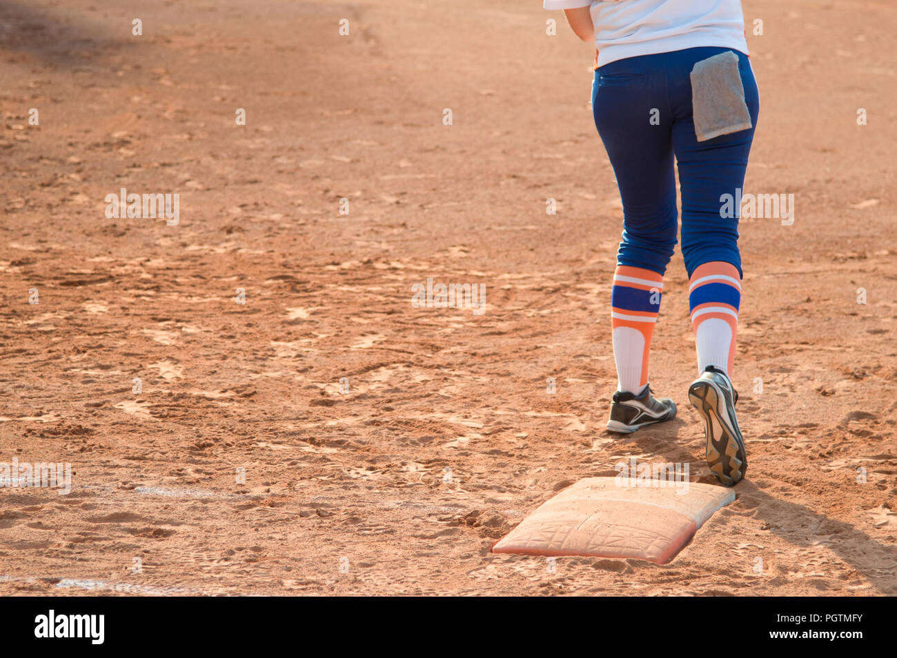 Player stand on home plate in a baseball (softball) dusty field, with ...