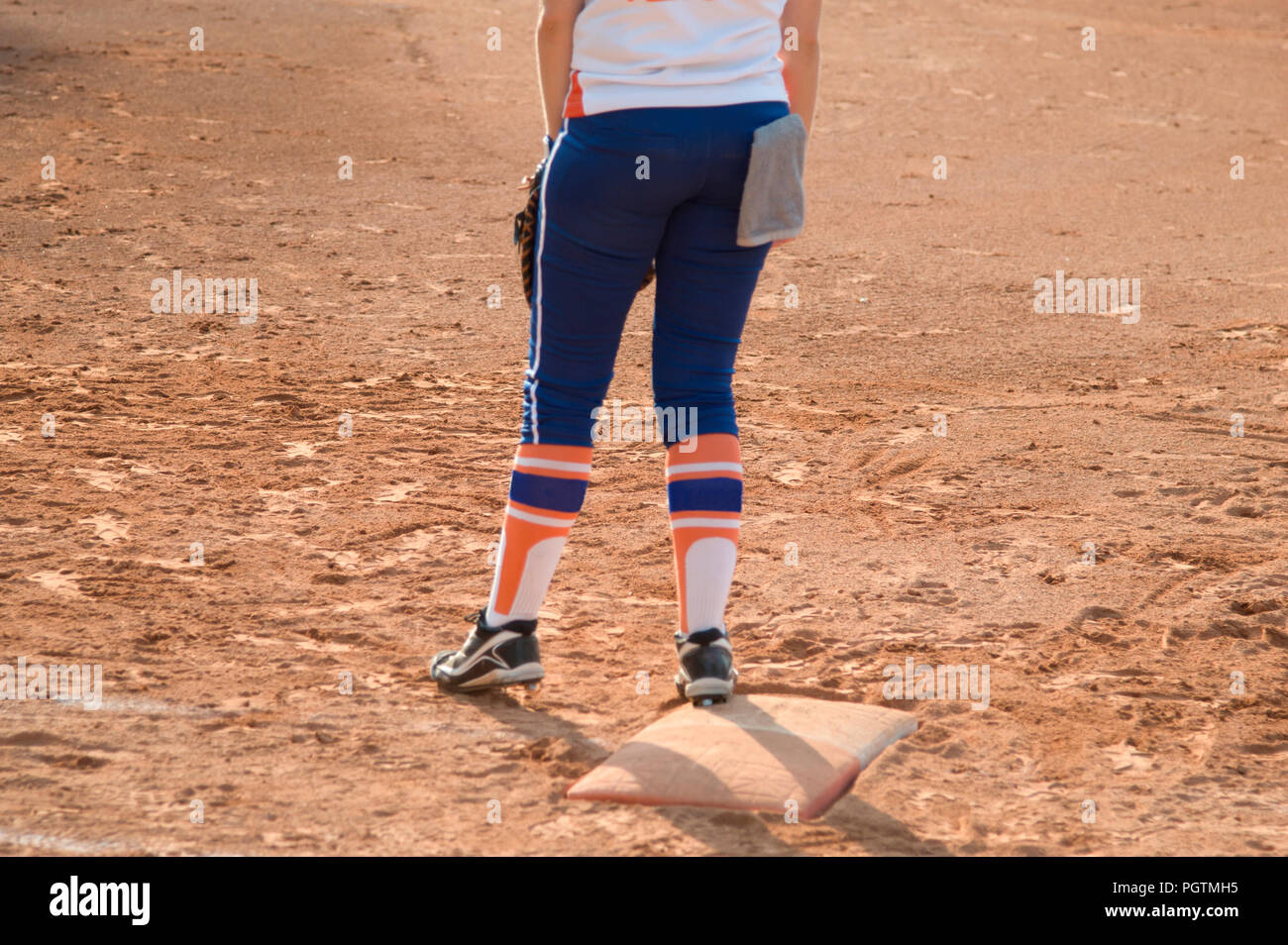 Player stand on home plate in a baseball (softball) dusty field, with ...