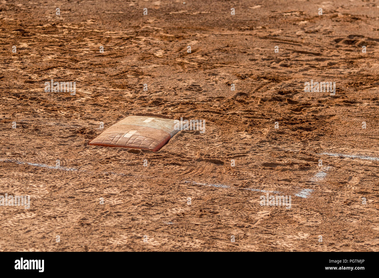 Detail of a home plate in a baseball (softball) dusty field, with ...