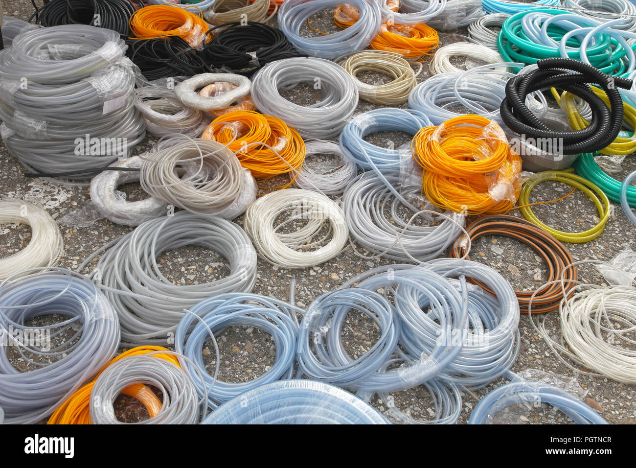 Big bunch of hoses and tube coils Stock Photo - Alamy