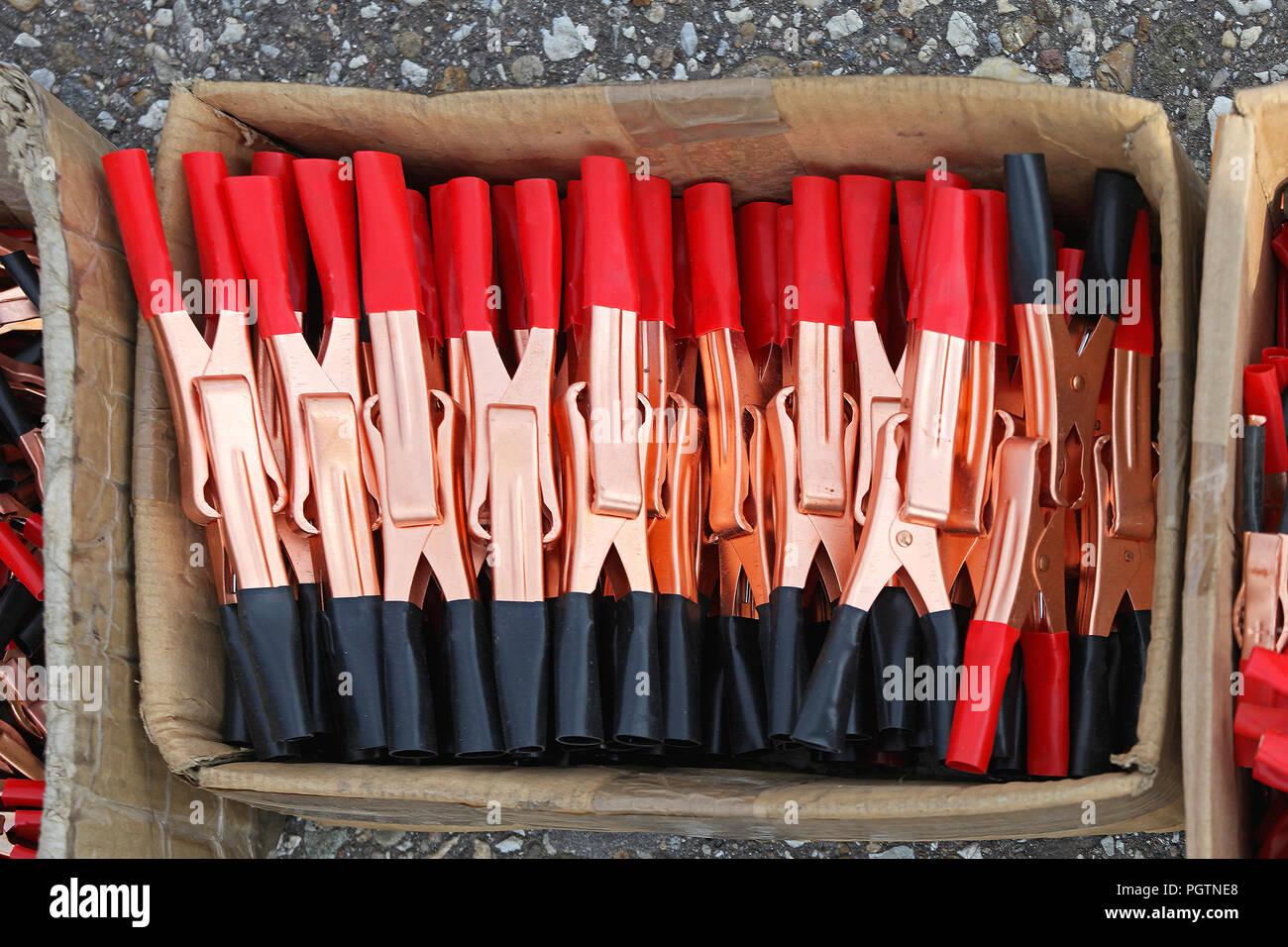 Electric terminal clamps in red and black Stock Photo - Alamy