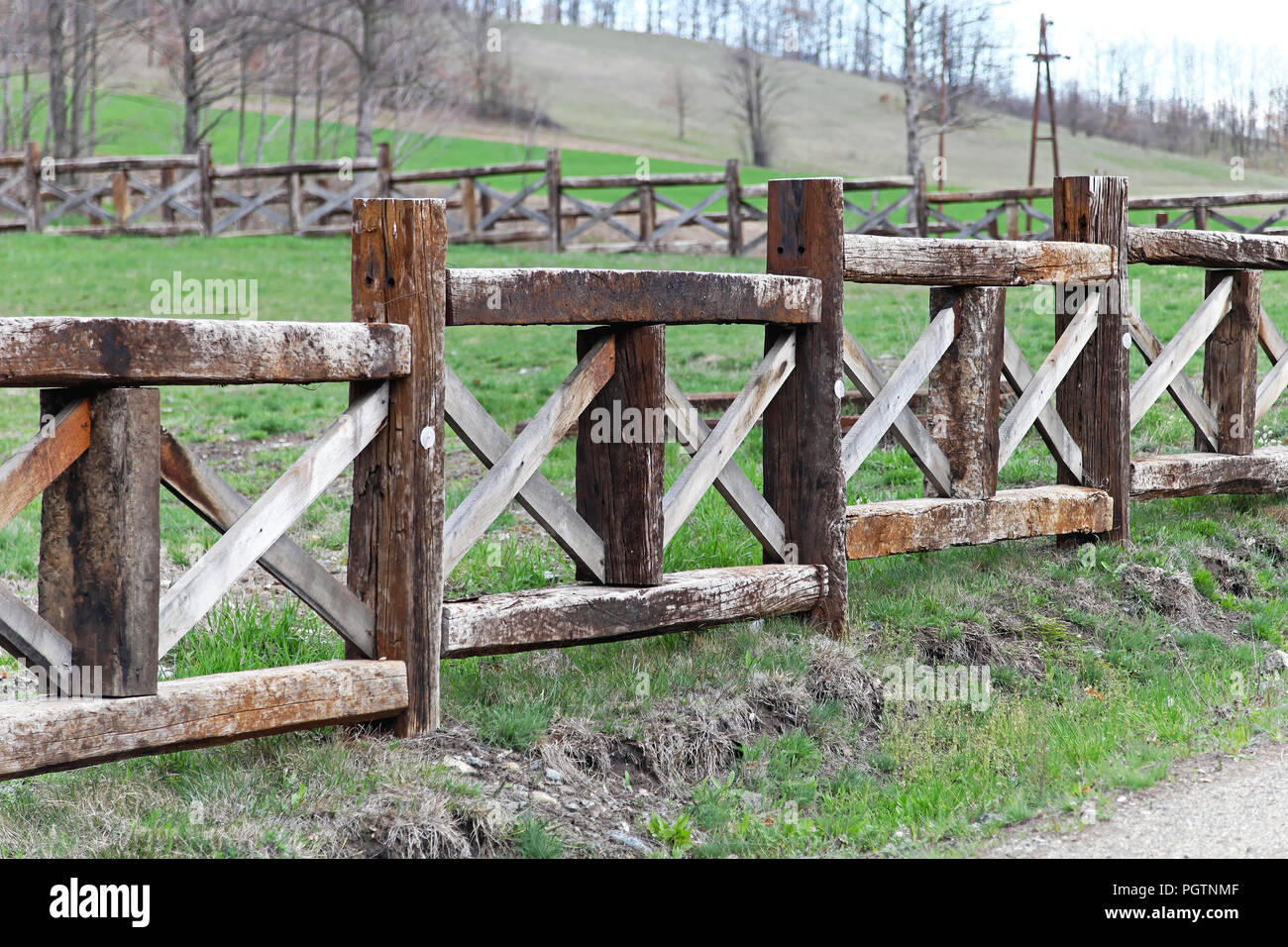 Rural wooden fence border in a row Stock Photo - Alamy