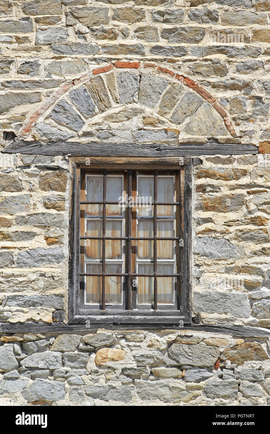Window with bars at medieval Ouranopoli tower Stock Photo - Alamy