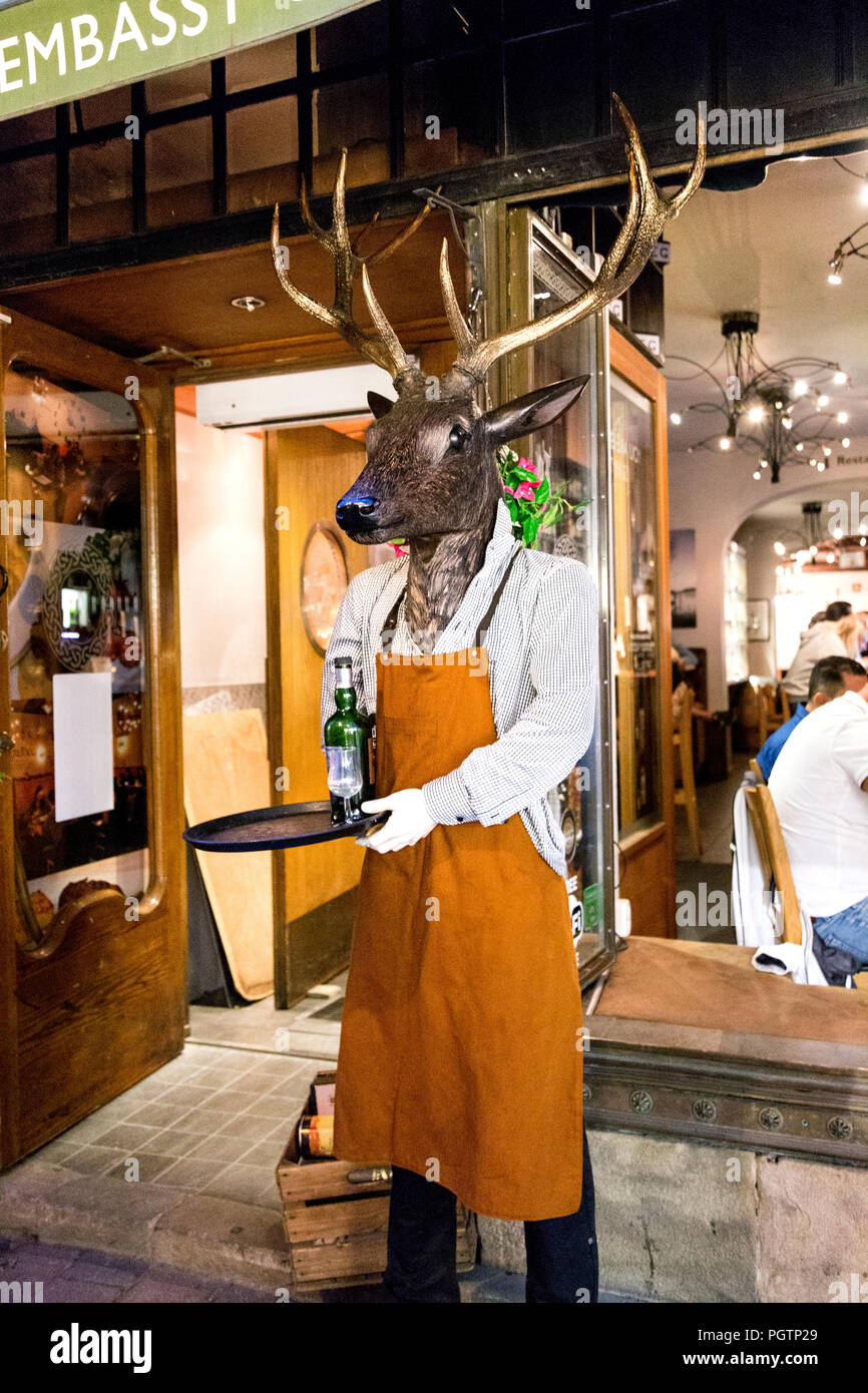 Waiter statue with a deer head holding a tray outside Ardbeg Embassy ...