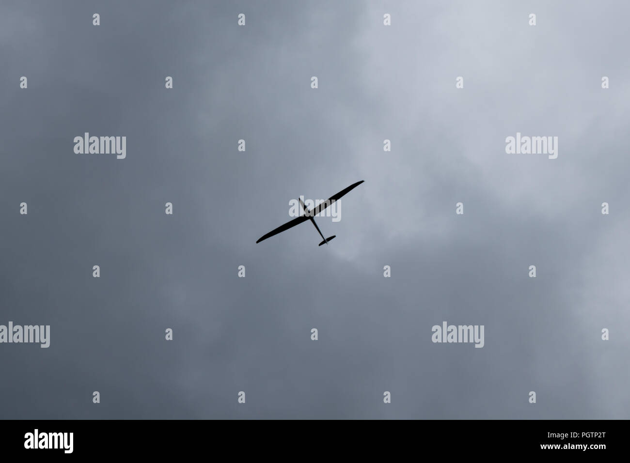 A Glider flying into storm Stock Photo - Alamy