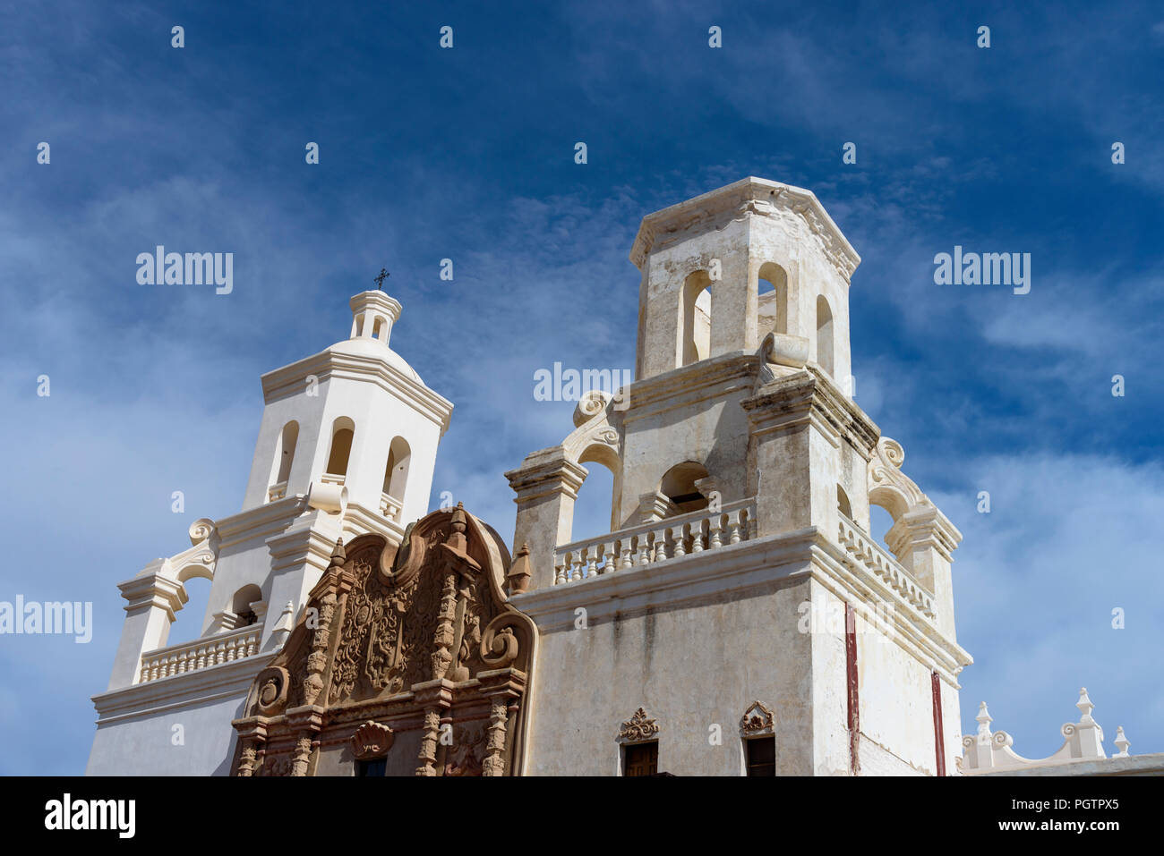 Mission Xavier bell towers against a blue sky with clouds Stock Photo ...