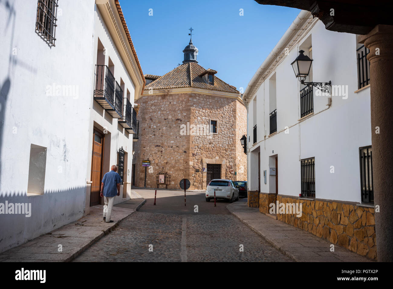 Tembleque, Spain, is a small village with a church and clock tower at ...