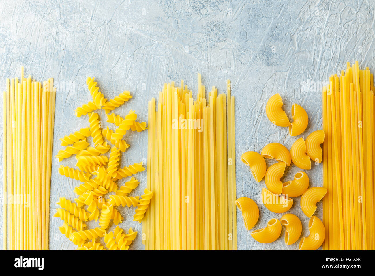 Variety of types and shapes of dry Italian pasta - Spaghetti, Linguine ...