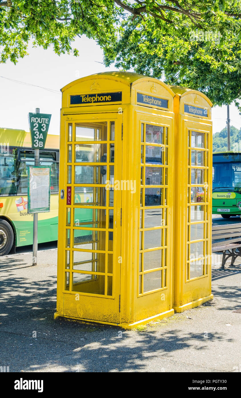 Yellow telephone at St Peter Port, Guernsey Stock Photo - Alamy